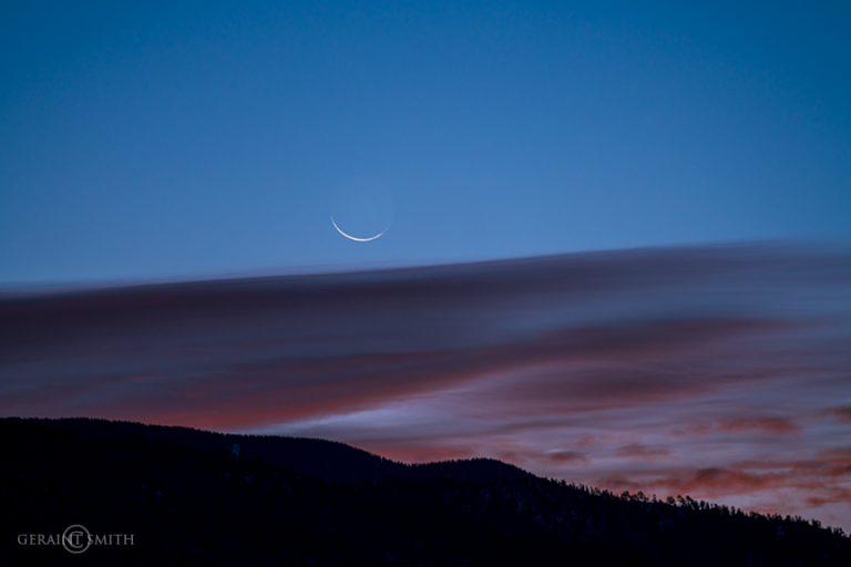 Waning crescent moon rising over the Sangre de Cristo Mountains